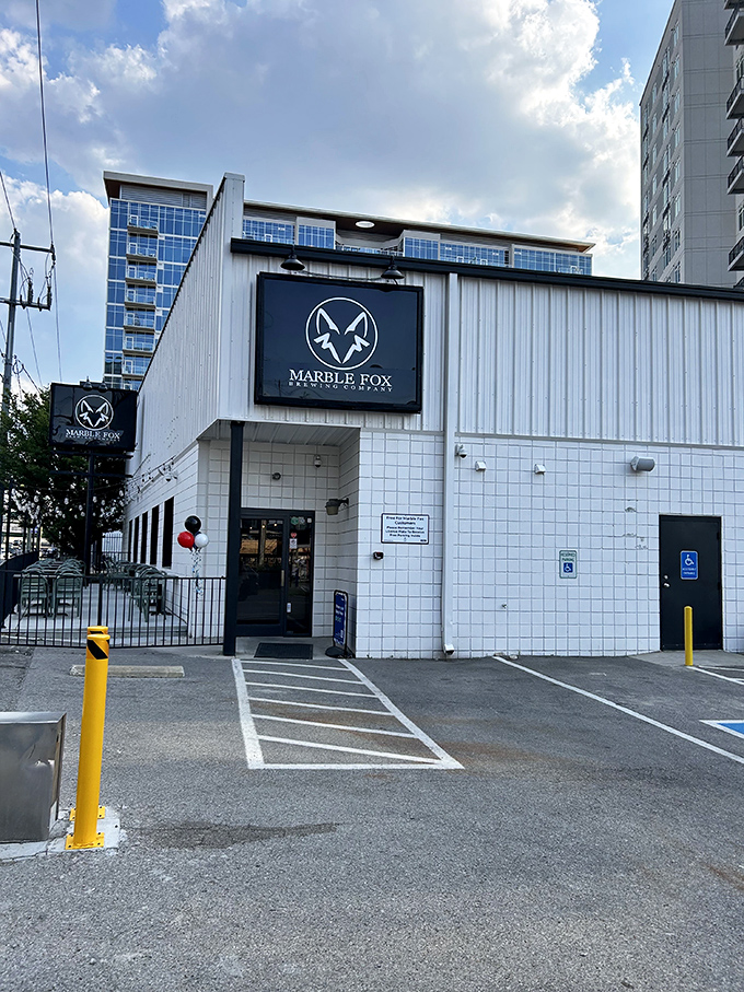 The unassuming white exterior of Marble Fox Brewing Company stands like a blank canvas, hiding the flavor explosion waiting inside. Nashville's best-kept liquid secret.