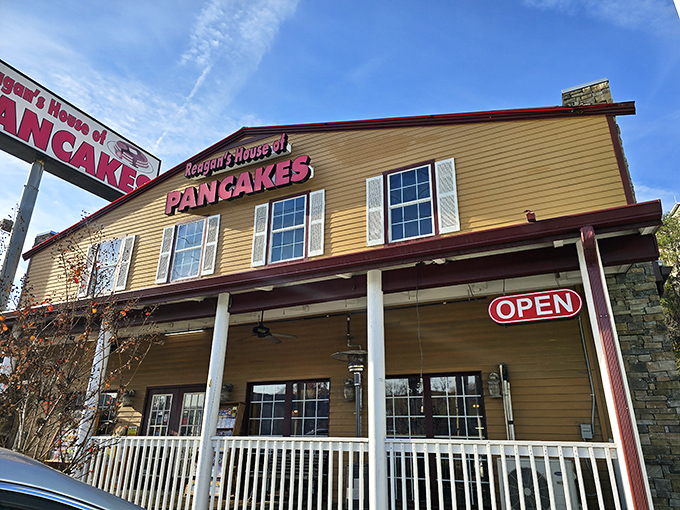 The honey-colored exterior of Reagan's House of Pancakes stands like a beacon of breakfast hope along Pigeon Forge's busy Parkway, promising carb-loaded bliss within.