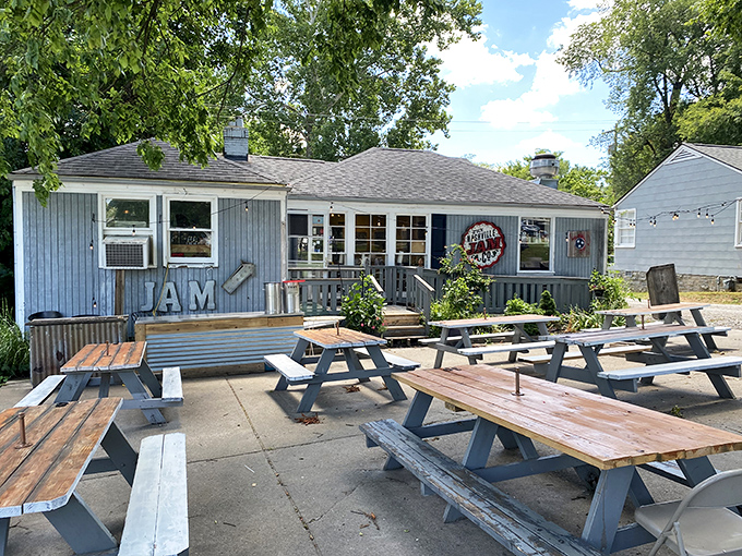 The unassuming gray exterior of Nashville Jam Co. is like finding a secret breakfast club where the password is "hungry" and everyone gets in.