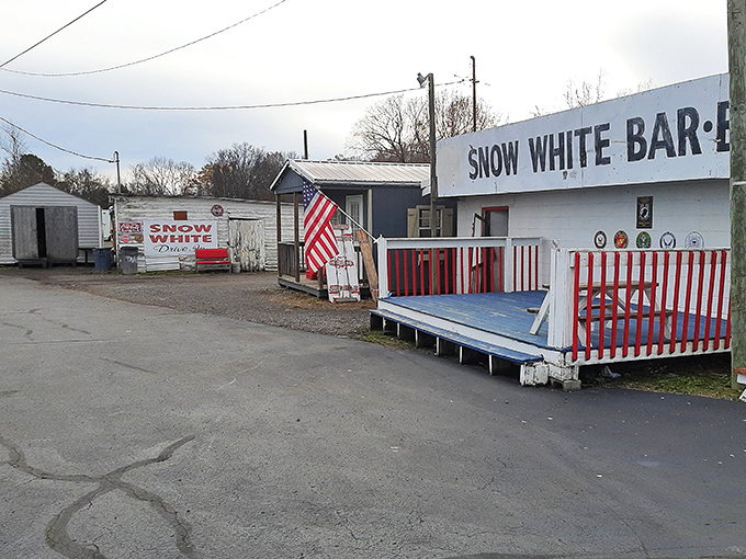 The iconic red sign beckons hungry travelers like a neon lighthouse. Snow White Drive In has been Lebanon's comfort food beacon since the Eisenhower administration.