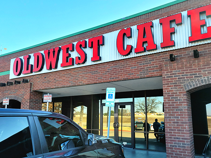 The bold red letters against corrugated metal announce Oldwest Cafe like a breakfast beacon. No fancy frills needed when what's inside speaks volumes.