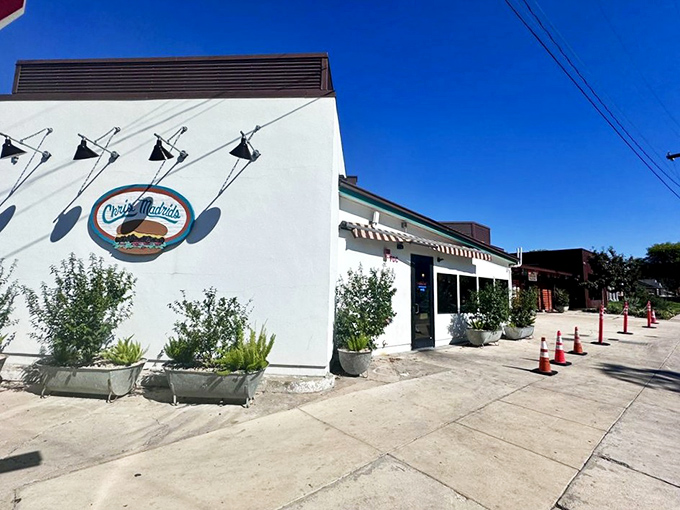 The corner of Blanco and Hollywood marks the spot where burger dreams come true at Chris Madrid's iconic white building.