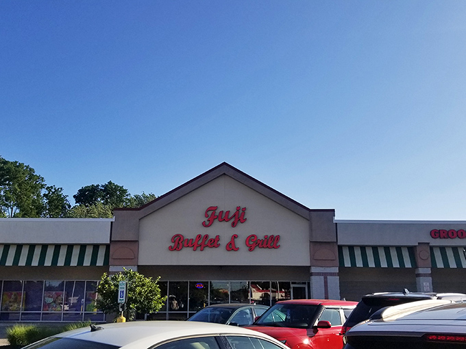 The bold red lettering of Fuji Buffet & Grill beckons like a siren song to hungry travelers on Mentor Avenue. Your stomach knows what that sign promises.