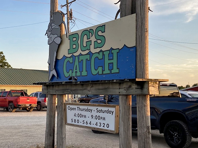 The unassuming exterior of BG's Catch stands like a beacon for hungry travelers, with its iconic fish sign promising seafood salvation in Kingston.