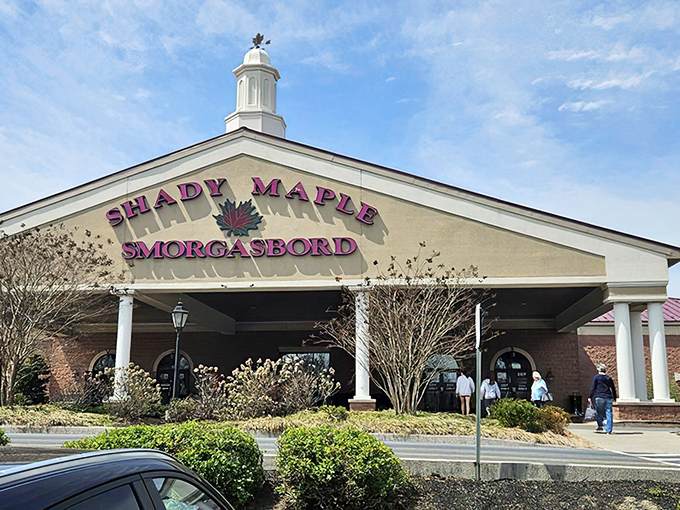 The iconic white facade of Shady Maple welcomes hungry pilgrims at sunset, promising a Pennsylvania Dutch feast that's worth every mile of the journey. 