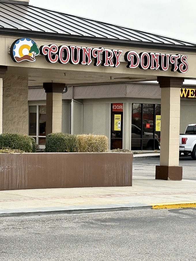The unassuming storefront promises nothing fancy&mdash;just the sacred covenant of exceptional donuts waiting inside. Simple, straightforward, perfect.
