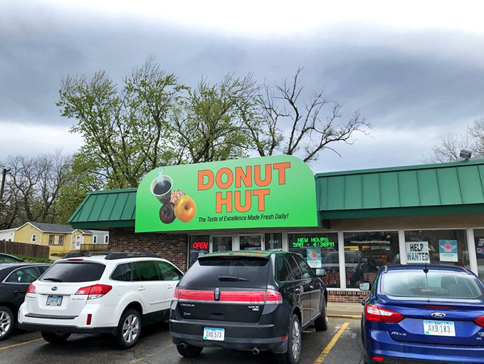 The green awning beckons like a sugar-coated lighthouse in a sea of ordinary breakfasts. Des Moines' morning pilgrimage spot doesn't need fancy signage when the donuts speak volumes.