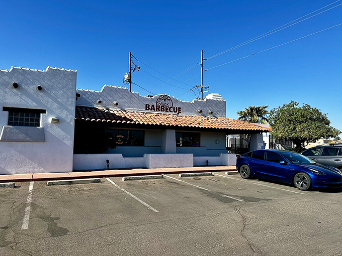 The white adobe exterior of Eric's Family Barbecue stands like a barbecue beacon against the Arizona sky, promising smoky treasures within.