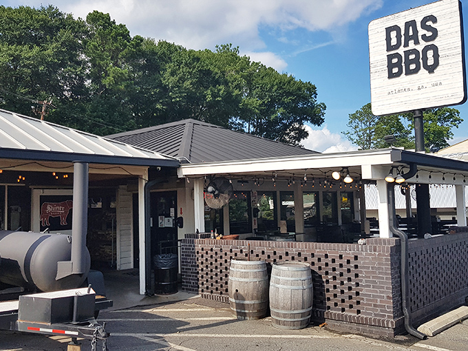 That classic barbecue joint exterior promises serious smoky business happening inside those welcoming doors.