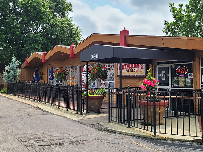 The American flag waves proudly outside Hayward's, as if to say, "The pursuit of happiness includes perfectly smoked ribs." Classic Kansas BBQ patriotism at its finest.