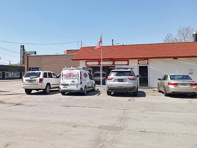 The modest red and white exterior of Hartland Bar-B-Que speaks the universal truth of BBQ: the less fancy the building, the better the meat inside.