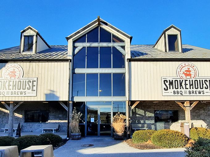 The barn-inspired architecture of Smokehouse BBQ & Brews stands proudly against the Pennsylvania sky, promising smoky delights within those wooden walls.
