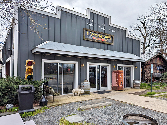The unassuming gray facade of Hammerdown Barbecue stands like a smoke signal to hungry travelers&mdash;architectural proof that the best BBQ joints never need fancy frills.