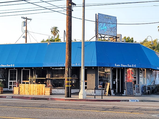 The unmistakable blue awning of Baby Blues BBQ stands as a beacon of smoky salvation on Lincoln Boulevard, promising barbecue bliss in the heart of Venice.