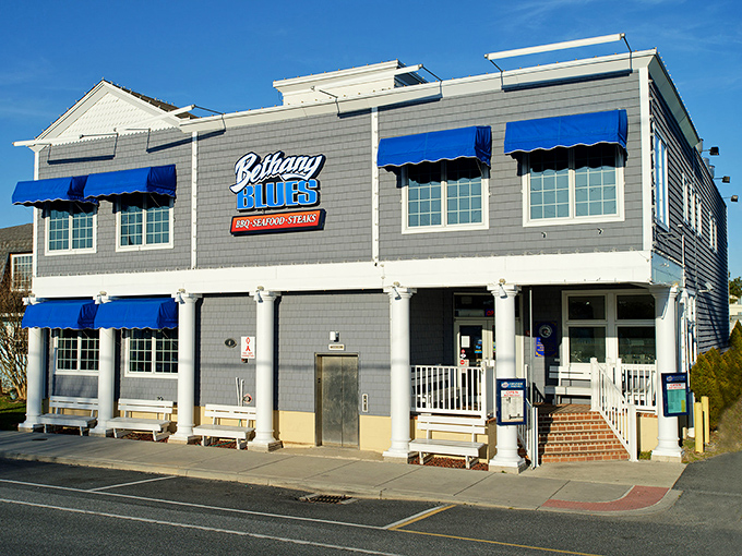 The coastal charm of Bethany Blues' exterior promises what lies within&mdash;a temple of smoke where beach vibes meet barbecue brilliance.