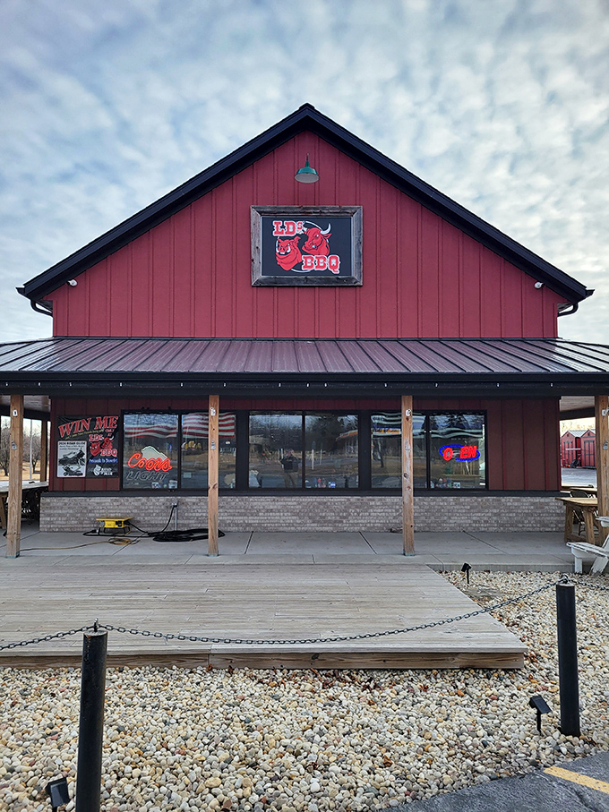 The red barn-style building stands like a beacon of barbecue hope against Wisconsin's blue sky. Meat pilgrims, your journey ends here.