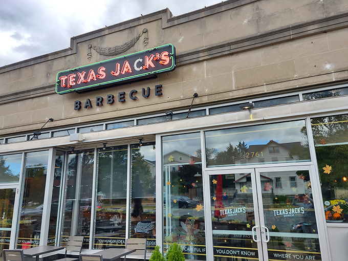 The inviting exterior of Texas Jack's Barbecue beckons with its vintage-style neon sign&mdash;like a beacon of smoky salvation on Arlington's Washington Boulevard.