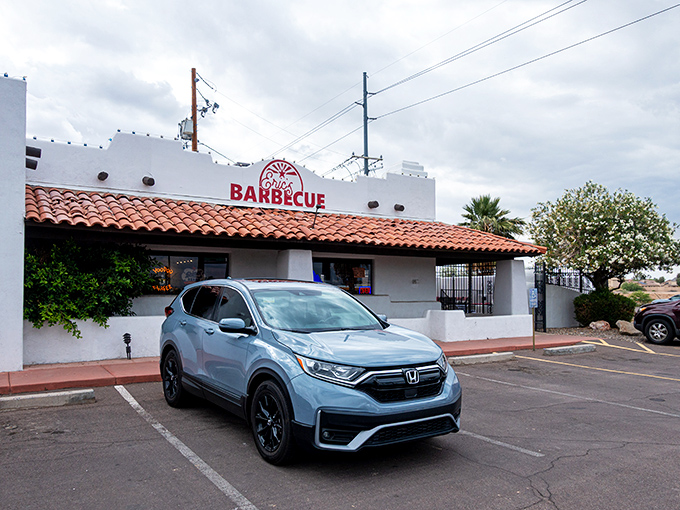 The white adobe exterior of Eric's Family Barbecue stands like a barbecue beacon against the Arizona sky, promising smoky treasures within.