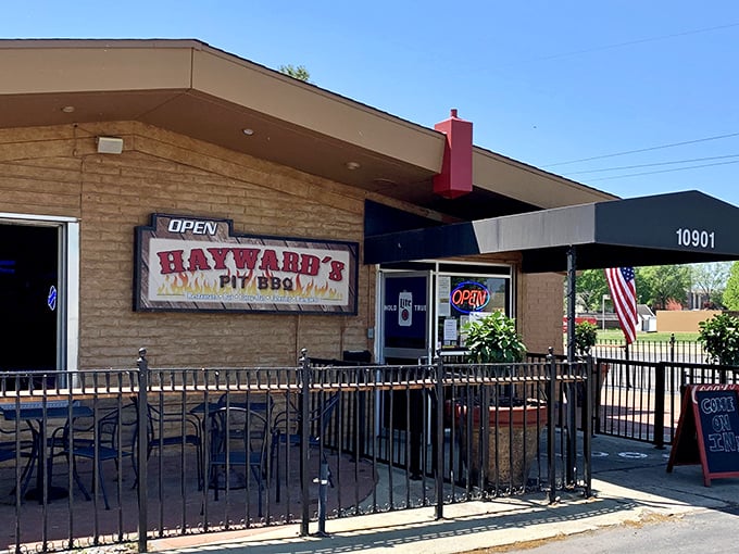 The American flag waves proudly outside Hayward's, as if to say, "The pursuit of happiness includes perfectly smoked ribs." Classic Kansas BBQ patriotism at its finest.