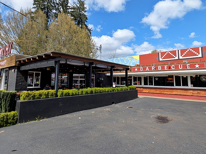 The iconic red exterior with its bold "BARBECUE" sign promises smoky delights within. Like a barbecue beacon calling to hungry travelers.