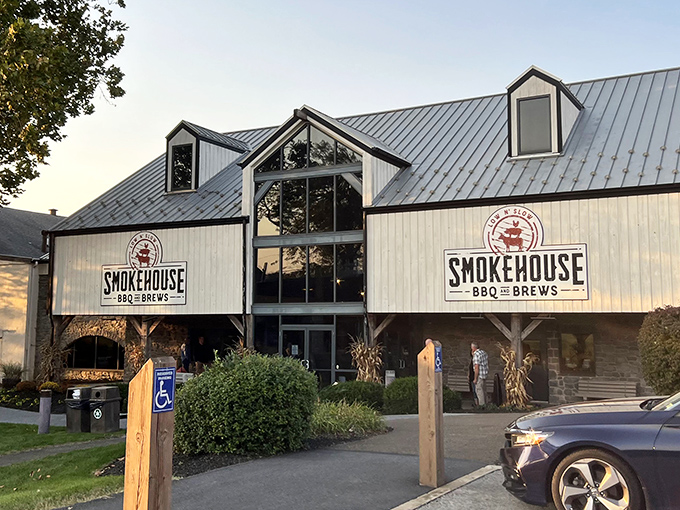 The barn-inspired architecture of Smokehouse BBQ & Brews stands proudly against the Pennsylvania sky, promising smoky delights within those wooden walls.