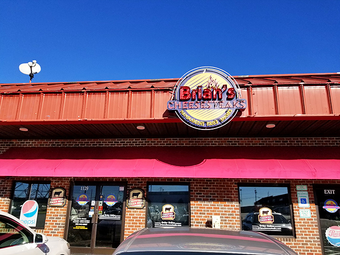 The brick façade might not scream "culinary destination," but that neon sign promises Philly-style satisfaction in the heart of Rocky Mount.