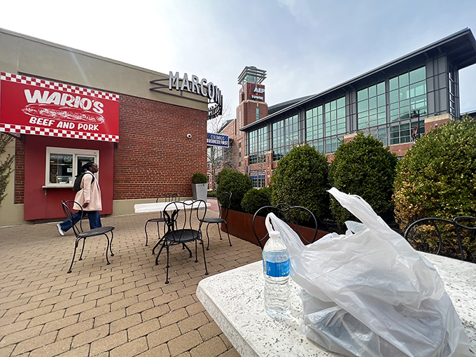 The unassuming brick exterior of Wario's might not scream "food destination," but that red checkered sign is like a beacon for sandwich aficionados across Columbus.