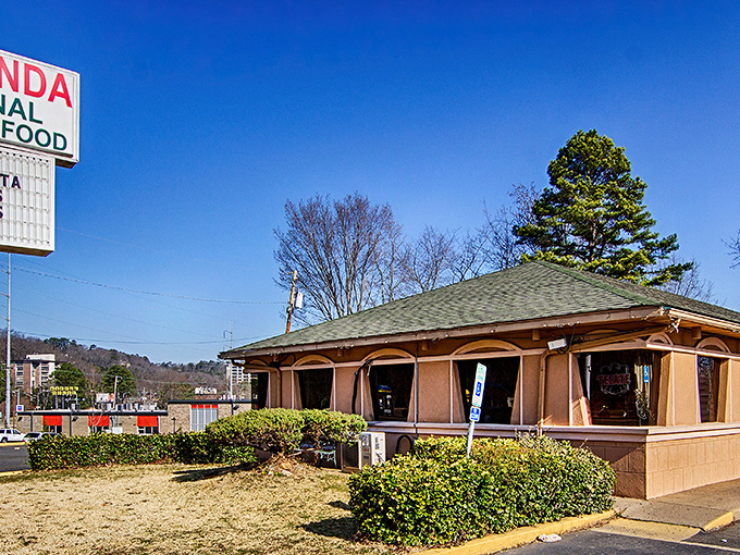 The unassuming salmon-colored exterior of La Hacienda stands like a culinary lighthouse amid autumn foliage, promising authentic Mexican treasures within.