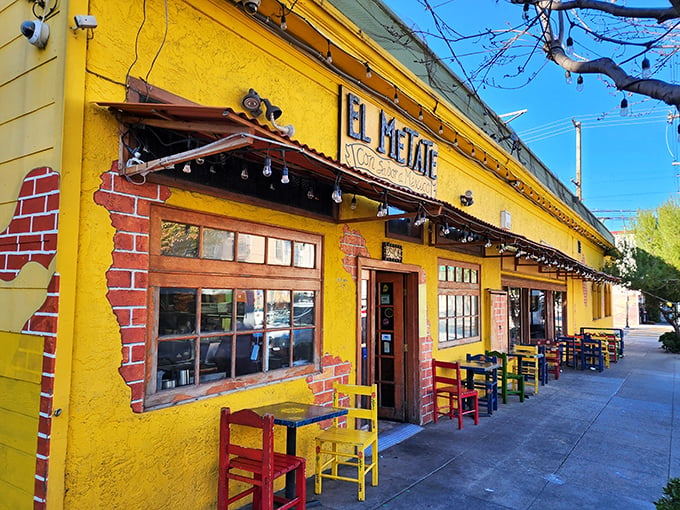 That sunshine-yellow exterior isn't just a building&mdash;it's a mood-altering device that says "happiness served daily." The colorful chairs outside are just a preview of the fiesta within.