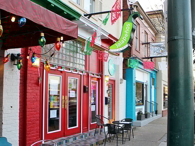 The modest red storefront might not scream "culinary destination," but those colorful papel picado flags are waving you in for a fiesta of flavors.