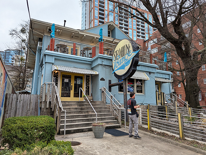 The little blue building that could. Nestled among Atlanta's skyscrapers, Steamhouse Lounge's charming exterior promises seafood treasures within those modest walls.