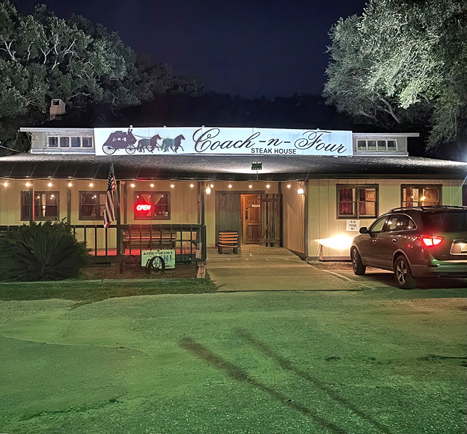 The unassuming exterior of Coach-n-Four Steakhouse stands as a time capsule of old Florida dining, where steak legends are born beneath towering pines.
