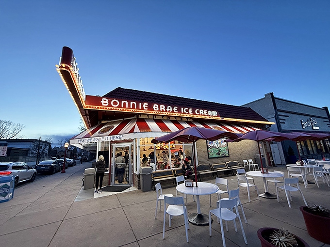 The iconic red-striped awning of Bonnie Brae Ice Cream stands as Denver's beacon of frozen happiness, drawing crowds even on chilly Colorado evenings.