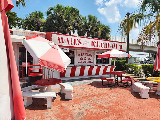 The classic red and white exterior of Wall's beckons like a sweet mirage under swaying palms, promising frozen salvation from Miami's relentless sunshine.