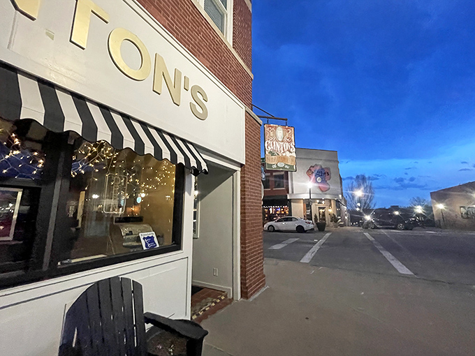 The classic storefront beckons with its vintage charm—Clinton's iconic awning and cozy outdoor seating invite you to step back in time on Independence Square.