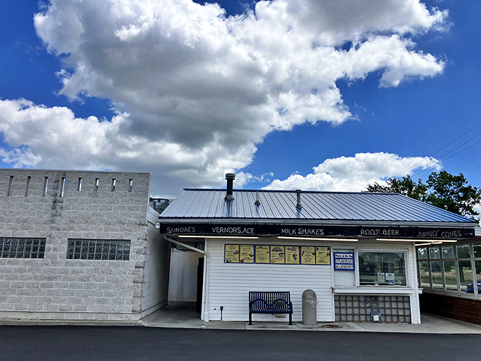 The white clapboard shrine to frozen happiness stands proudly in Akron, beckoning custard pilgrims from miles around with its classic Americana charm. 