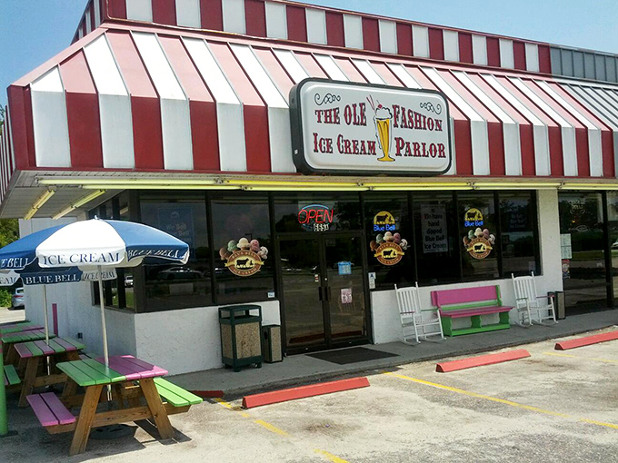 The red and white striped awning isn't just eye-catching&mdash;it's the universal signal that serious ice cream happiness awaits inside. No filter needed on this classic Americana.
