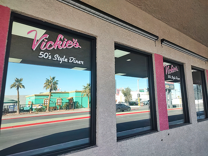 The unassuming exterior of Vickie's Diner stands as a pink-signed beacon of hope for hungry souls seeking refuge from Vegas glitz.