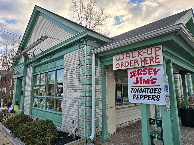 The unassuming mint-green exterior with its no-nonsense "WALK-UP ORDER HERE" sign is your first clue: this place isn't about looks&mdash;it's about flavor that commands attention.