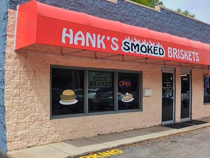 The bright red awning of Hank's stands out like a beacon for barbecue pilgrims, promising smoky salvation inside this unassuming Indianapolis treasure.