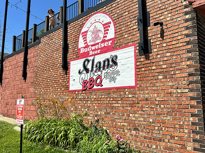 The brick exterior of Slap's BBQ stands like a temple to smoked meat, promising delicious secrets within its unassuming walls.