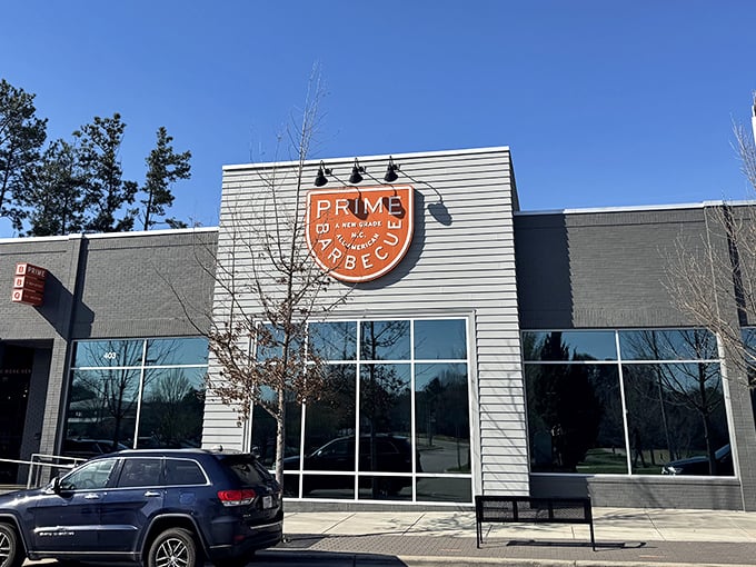 The modern facade of Prime Barbecue stands like a beacon of hope for hungry travelers, promising smoky delights within its contemporary walls.