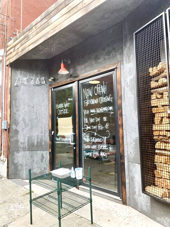 The industrial-chic exterior with its caged firewood display isn't just Instagram bait&mdash;it's a smoky promise of what awaits inside. Meat destiny calls. 