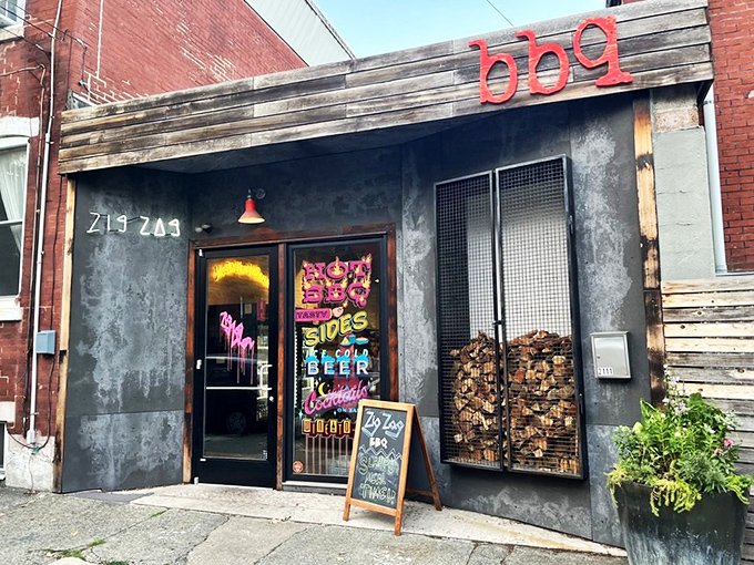 The industrial-chic exterior with its caged firewood display isn't just Instagram bait&mdash;it's a smoky promise of what awaits inside. Meat destiny calls. 