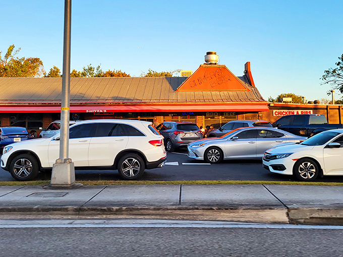 The log cabin exterior with its bright red trim stands like a delicious mirage in Homestead, promising smoky treasures within. Florida's answer to barbecue paradise.