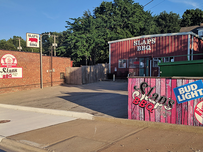 The brick exterior of Slap's BBQ stands like a temple to smoked meat, promising delicious secrets within its unassuming walls.