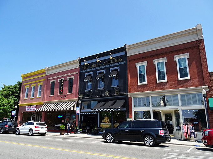 Historic storefronts with classic blue awnings create that perfect small-town ambiance where your dollar stretches further than your weekend plans.