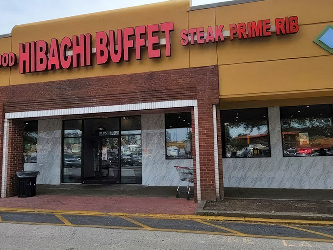 The golden-yellow exterior of Hibachi Buffet beckons like a beacon of culinary abundance on Buford Highway, with its bold red lettering promising seafood, steak, and prime rib adventures within.