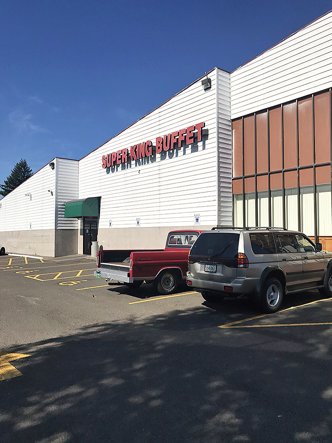 The unassuming exterior of Super King Buffet stands like a culinary fortress, promising treasures within that the modest fa&ccedil;ade cleverly conceals from passing traffic. 
