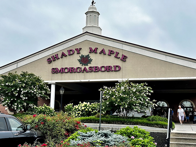 The iconic white facade of Shady Maple welcomes hungry pilgrims at sunset, promising a Pennsylvania Dutch feast that's worth every mile of the journey. 